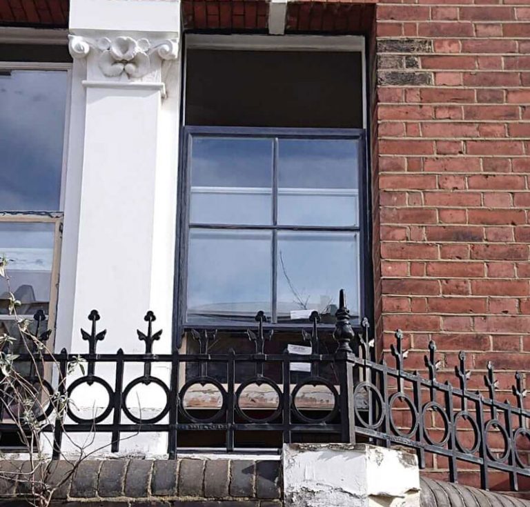 Original sashes double glazed and undercoated in grey ready for black ...